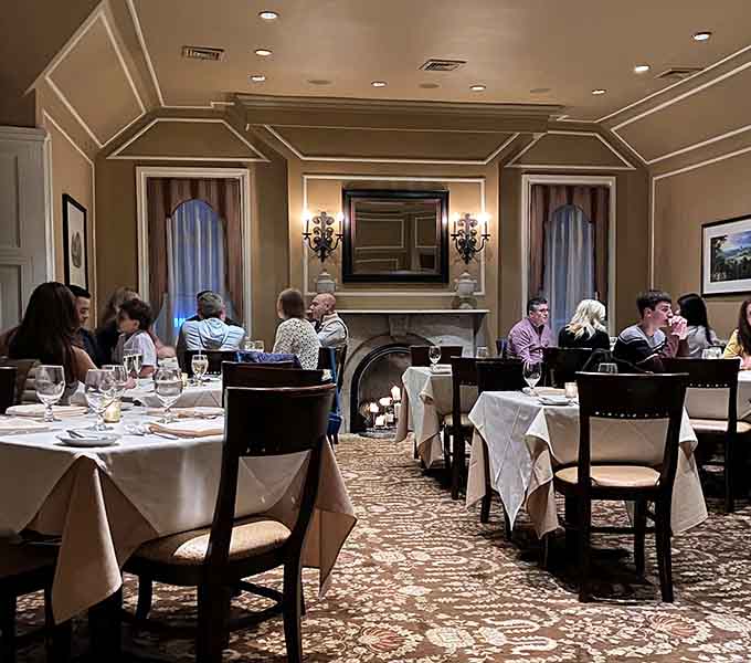 Diners enjoying their meals in an atmosphere that balances sophistication with genuine warmth and comfort.