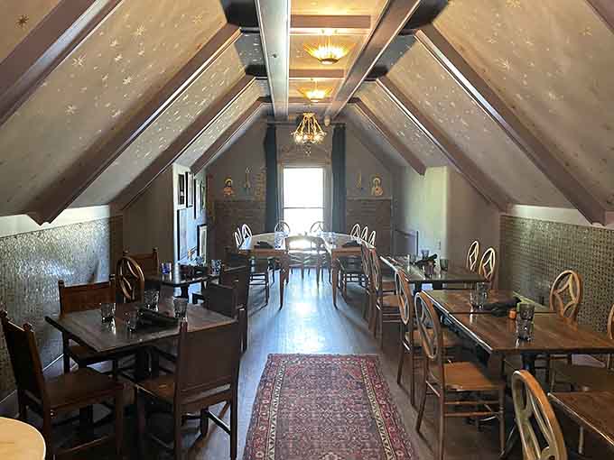 The attic dining room features soaring ceilings and intimate tables where conversations flow as smoothly as the beer below.