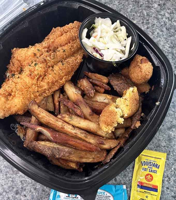 That golden catfish fillet could double as a small blanket, served with all the classic accompaniments.