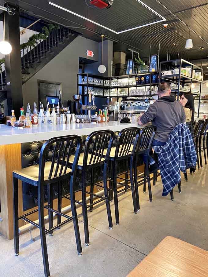 That sleek bar beckons solo diners and coffee enthusiasts to settle in for leisurely mornings watching the world wake up.