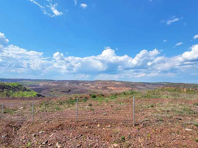 Blue skies and billion-ton excavations: just another Tuesday in Hibbing, where industrial tourism reaches spectacular new heights.
