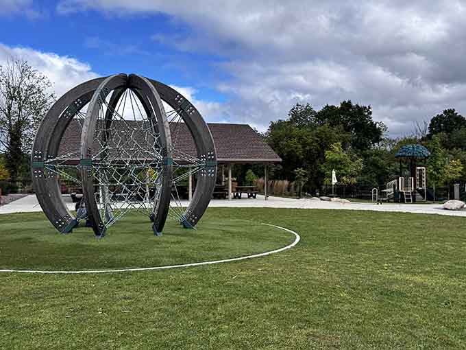 Modern climbing equipment meets artistic design, proving playgrounds have evolved significantly since our rusty metal days.