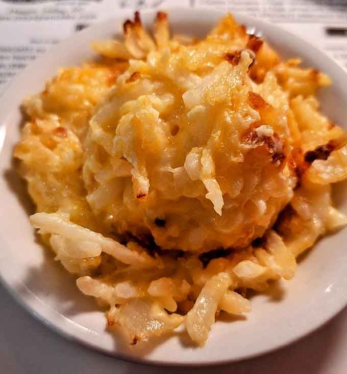 Hash browns achieving that golden-brown perfection that separates the breakfast amateurs from the true morning meal professionals everywhere.
