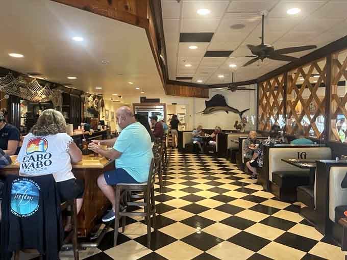 The bar area with checkered floors gives off classic diner vibes without the grease-stained menus.