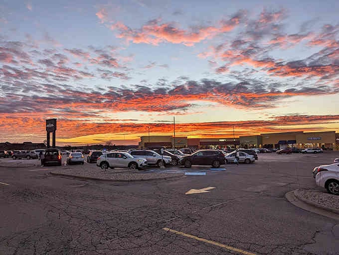 Sunset over the parking lot proves even mundane moments can be beautiful when you've scored incredible deals inside.