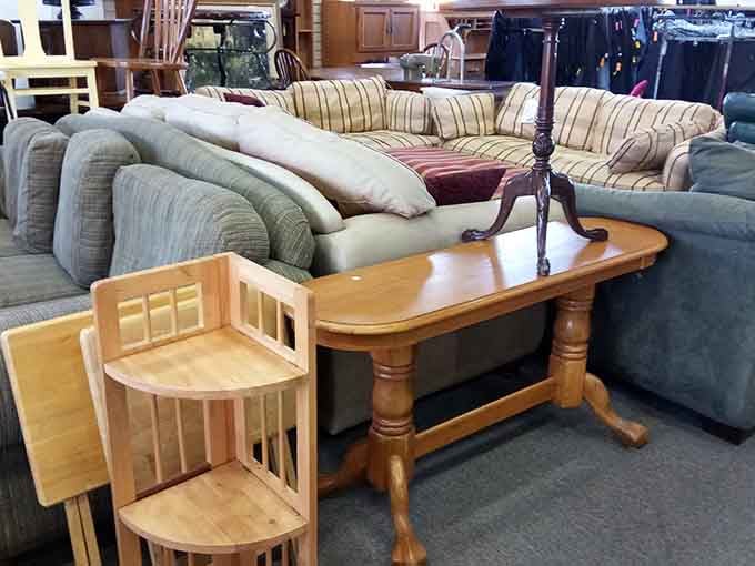 Couches, tables, and chairs arranged like a furniture showroom where everything's actually within your budget for once.