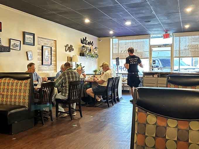 Morning regulars gathering around tables like it's the most important meeting of the day, which it probably is.