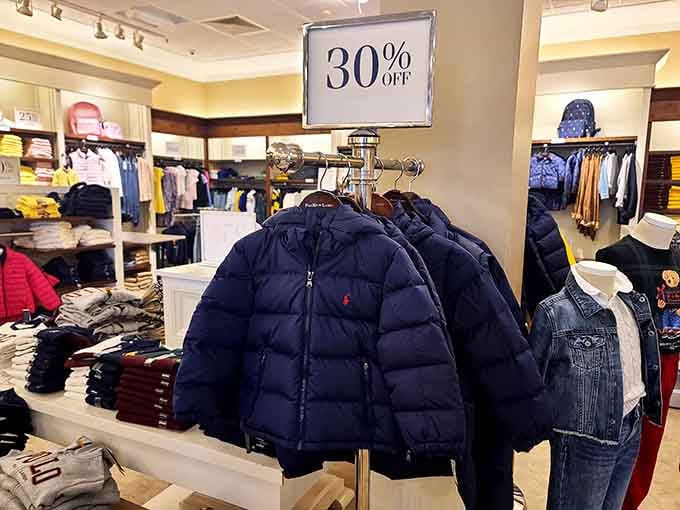 Winter coats piled high like fluffy clouds of warmth, proving that staying cozy doesn't require freezing your finances solid.