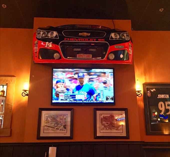 A race car grille on the wall reminds you that while NASCAR moves fast, good barbecue takes its sweet time.