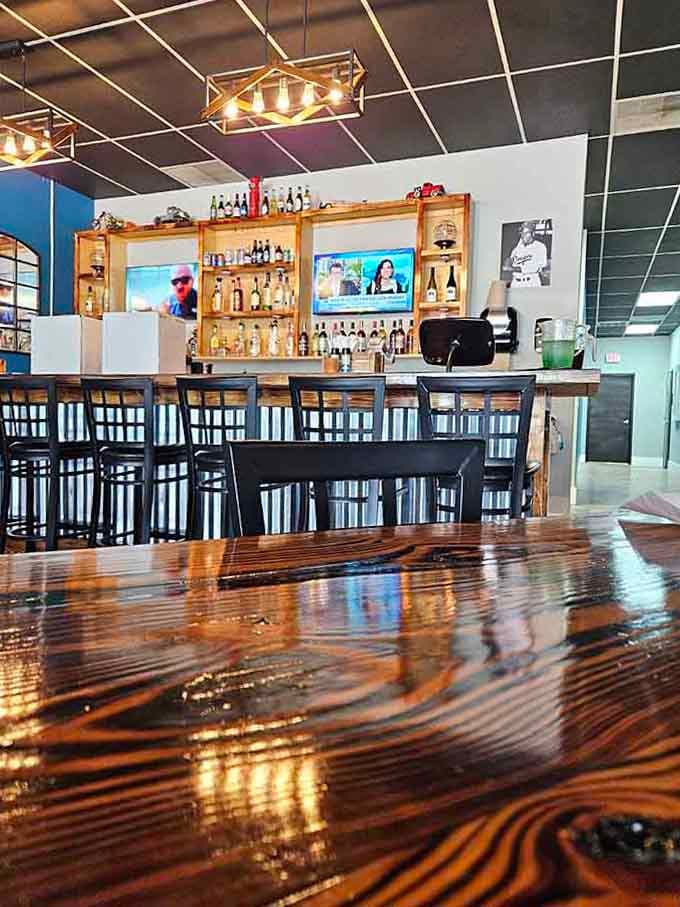 The bar area gleams with promise, offering liquid courage or celebration depending on what your evening requires tonight.