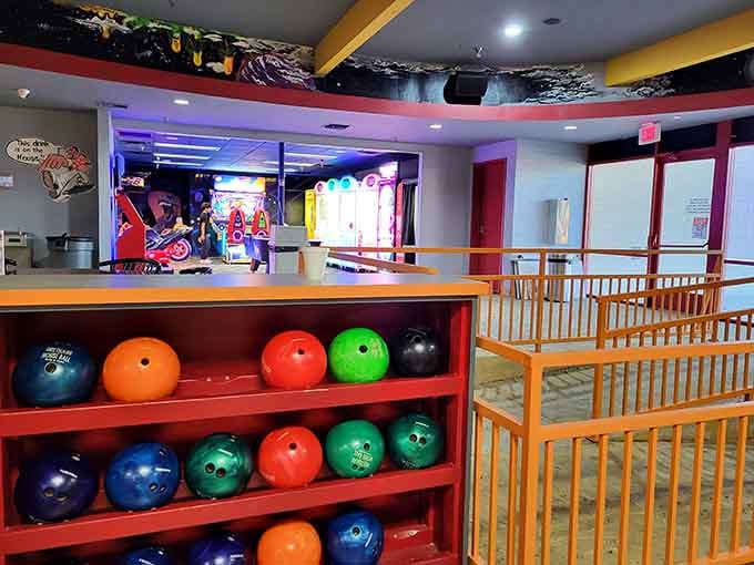 Bowling balls lined up like colorful soldiers, ready to march down the lanes and conquer those pins.