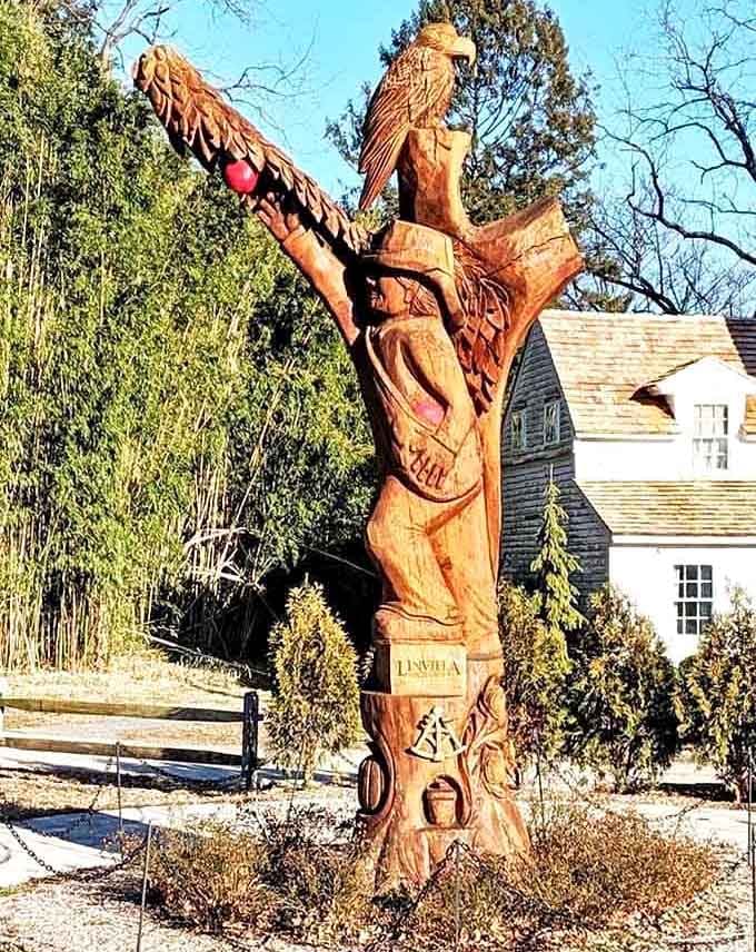 This carved wooden sculpture stands as a testament to craftsmanship and the farm's deep agricultural roots and artistry.