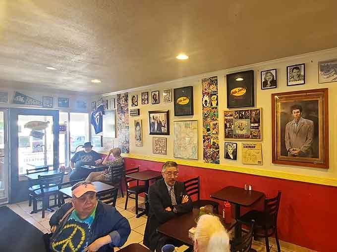 That portrait of Kramer photobombing real diners perfectly captures the playful spirit infusing every corner of this place.