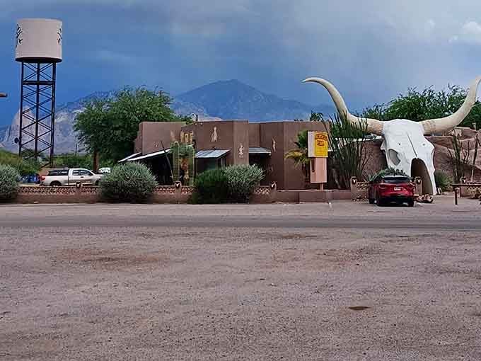 The whole complex sprawls across the desert with mountains behind, looking like a Western movie set that serves lunch.