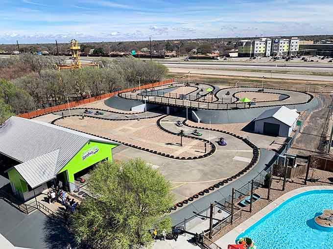 Go-kart tracks that twist and turn like a roller coaster designed by someone who understands pure joy.