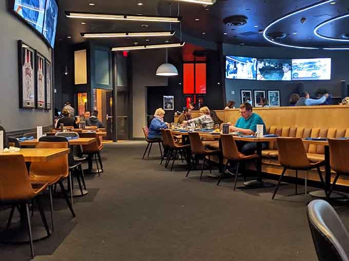 Comfortable seating arranged throughout the dining room where families, friends, and solo diners all find their perfect spot to settle in.