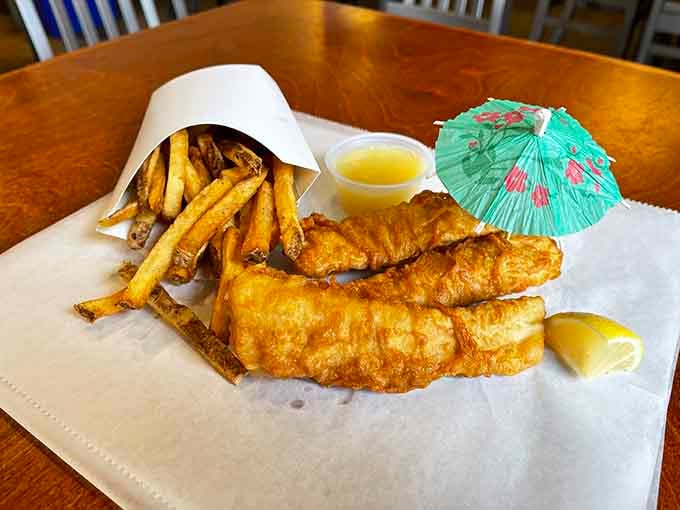Those golden fish fillets sprinkled with sea salt look like they just emerged from the fryer at peak crispiness.