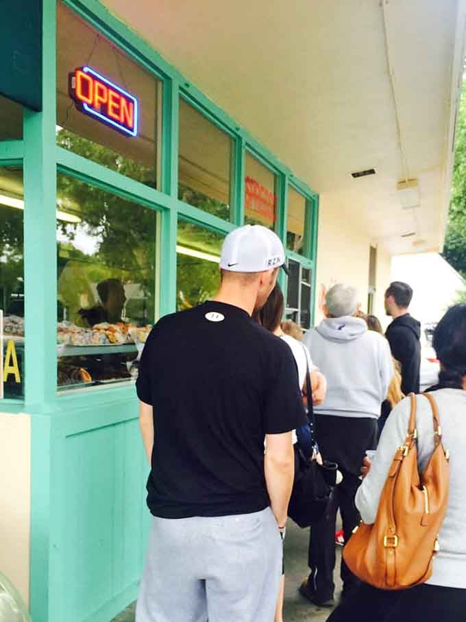 When people line up like this, you know something special is happening behind that turquoise-trimmed window.