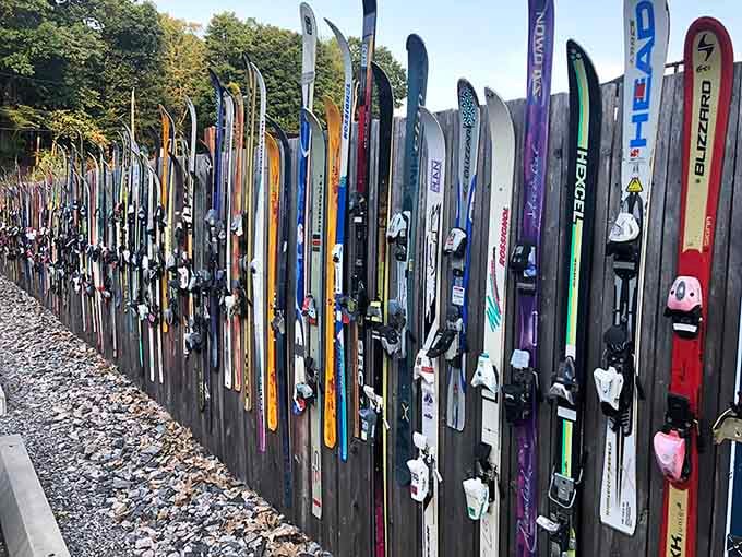 A fence made entirely of skis, because Switzerland and Connecticut both understand winter sports commitment.