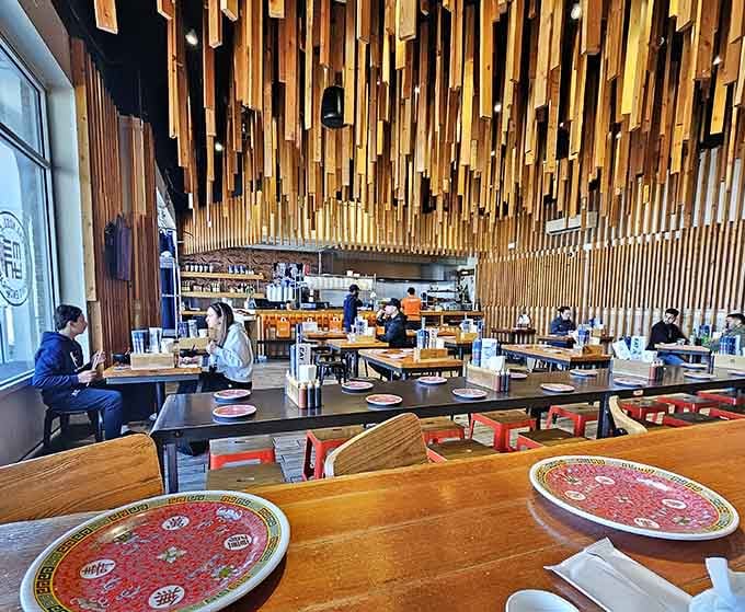 That stunning wooden ceiling installation turns a strip mall spot into something genuinely special and memorable.