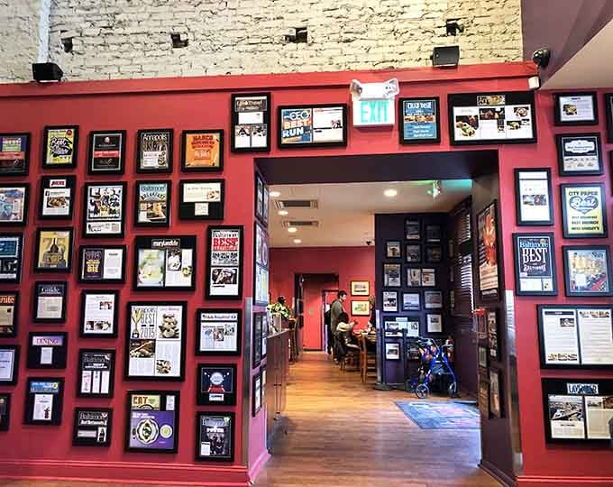 Awards and accolades covering the walls like breakfast battle scars, each frame telling stories of morning victories won.