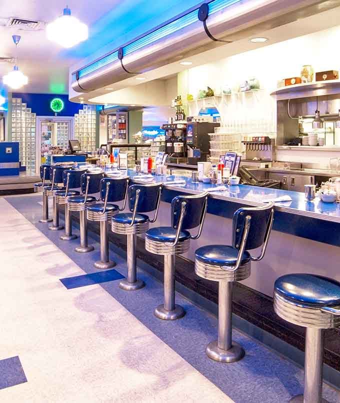 Classic counter seating where you can watch the magic happen while contemplating your third slice of pie.