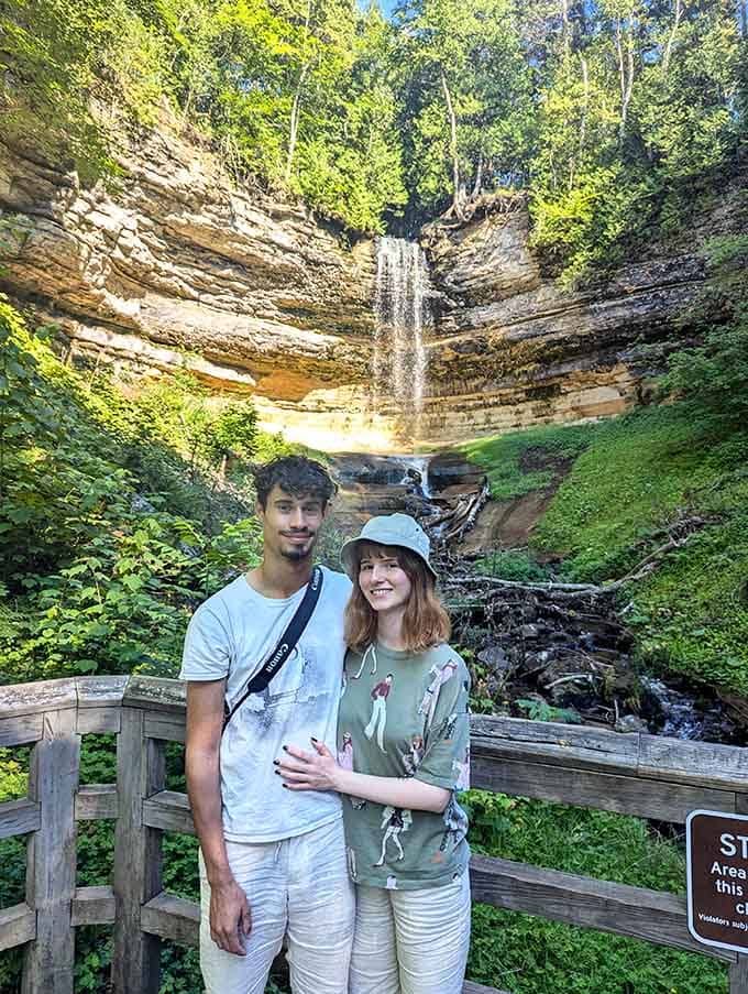 Making memories at Munising Falls, where nature provides the perfect backdrop for family adventures and selfies.