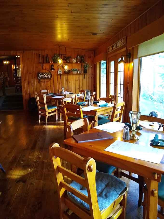 Golden lighting bathes the wooden dining room where tables await guests ready for an evening of genuine hospitality and great food.
