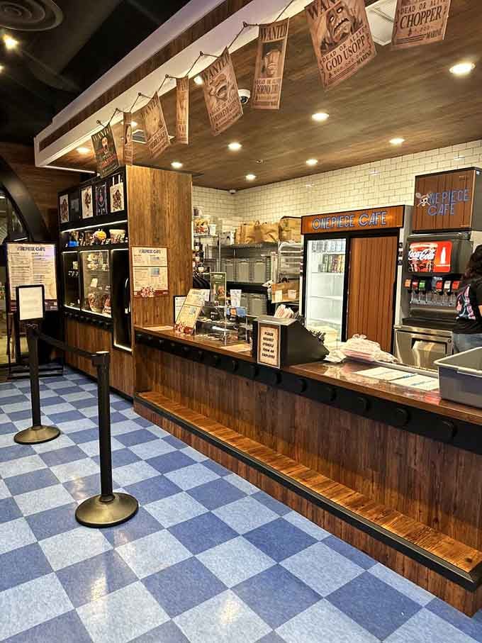 The ordering counter's warm wood tones and vintage wanted posters overhead set an authentic seafaring tavern atmosphere perfectly.
