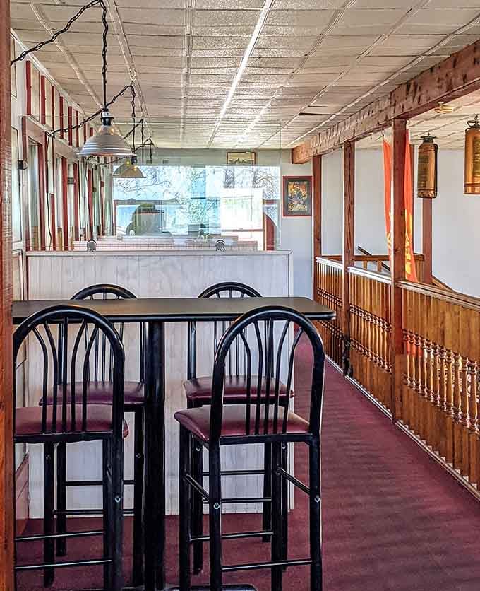 Upstairs seating provides a quieter escape, proving this place has thought of everything including your introvert friends.