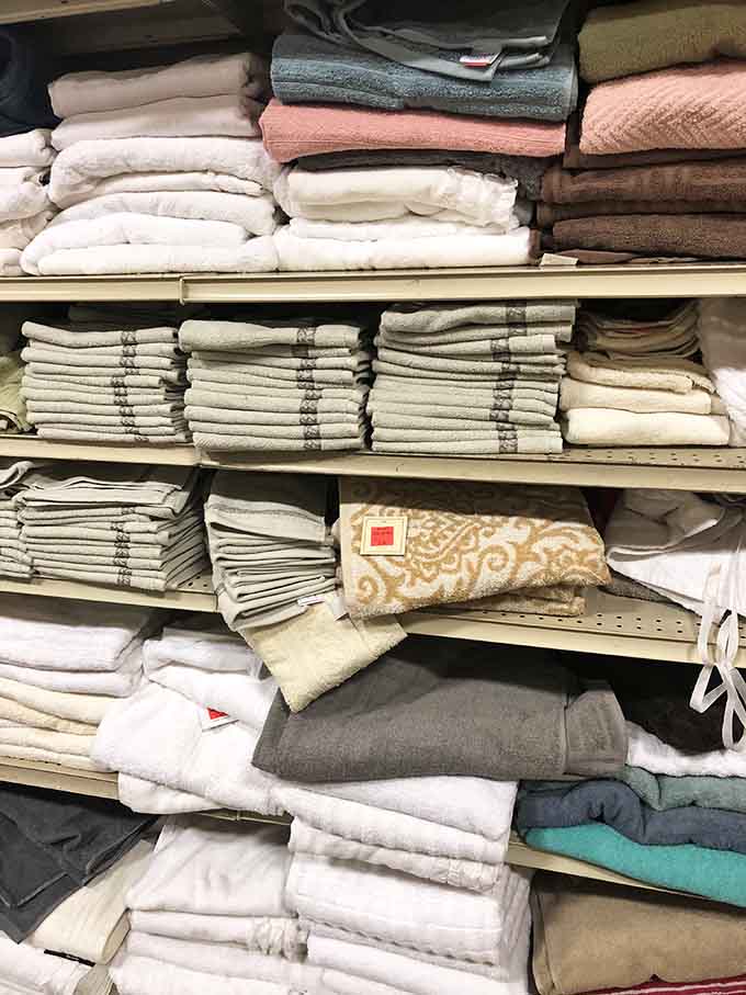 Towels stacked high in every color, soft and affordable, proving luxury doesn't always require those fancy department store prices.