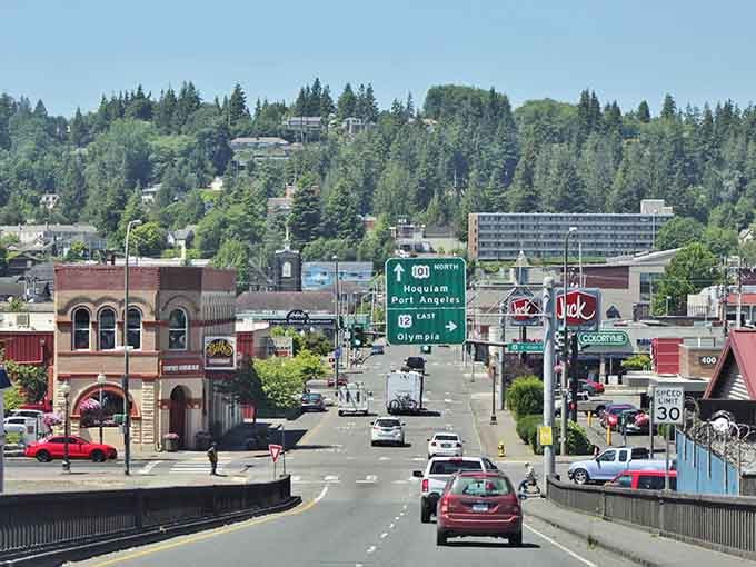 Aberdeen's main street shows off classic Pacific Northwest architecture with mountains keeping watch in the distance.