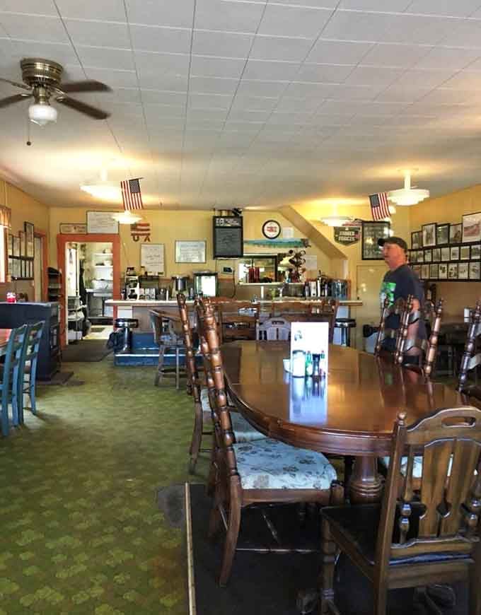 American flags and vintage photos line the walls, telling stories of travelers who've passed through these mountains.