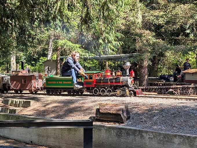A volunteer engineer guides passengers on their journey, sharing decades of railroading knowledge with anyone who asks.