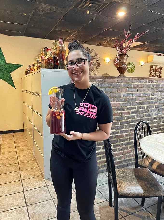 That smile says she knows exactly how good the homemade sauce in that bottle tastes, and she's proud of it.