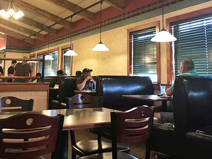 Booth seating offers cozy comfort for families plotting their next strategic approach to the buffet lines.