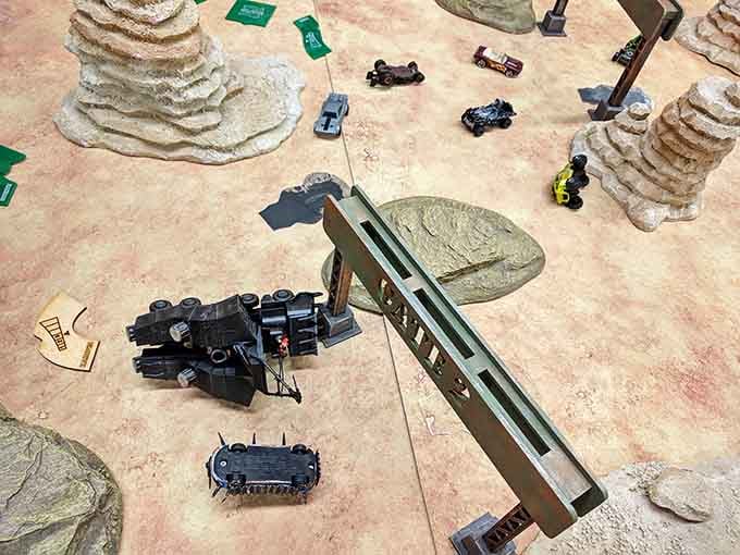 Miniature vehicles navigate desert terrain in a gaming setup that rivals anything George Lucas ever put on screen.