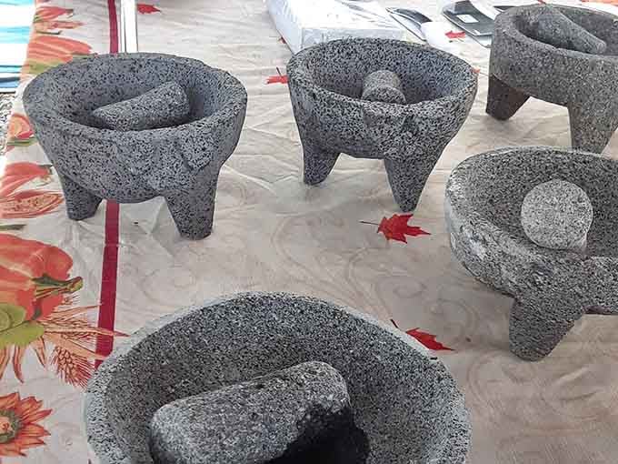 Traditional molcajetes waiting to grind spices and salsas, bringing authentic kitchen tools to your culinary adventures at home.