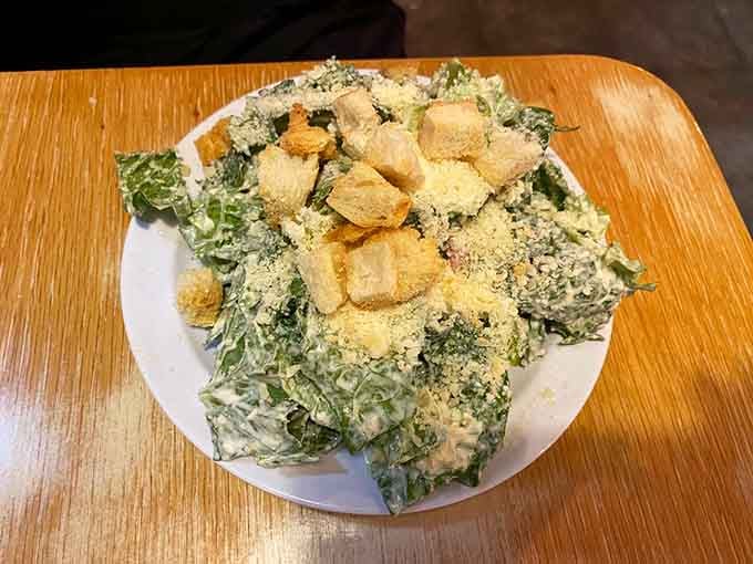 Caesar salad piled high with croutons and parmesan, because even pasta lovers need their greens occasionally.
