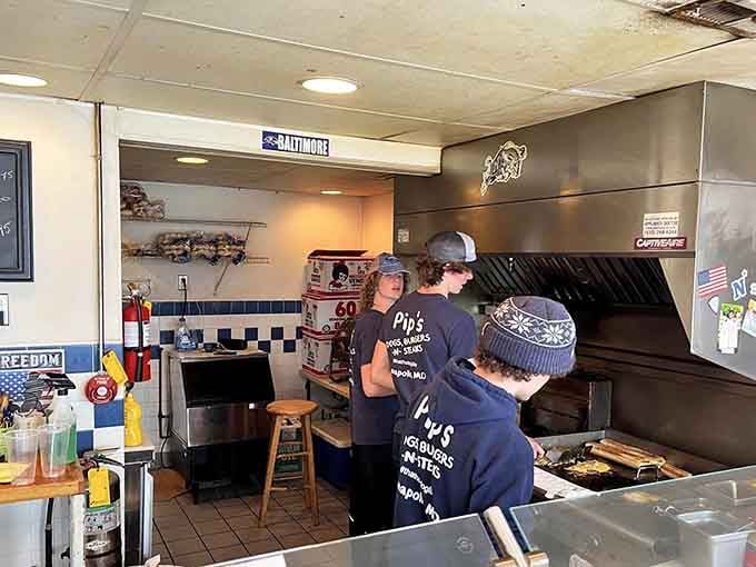 The crew working the grill with practiced efficiency, turning out delicious meals faster than you can say "extra onions."