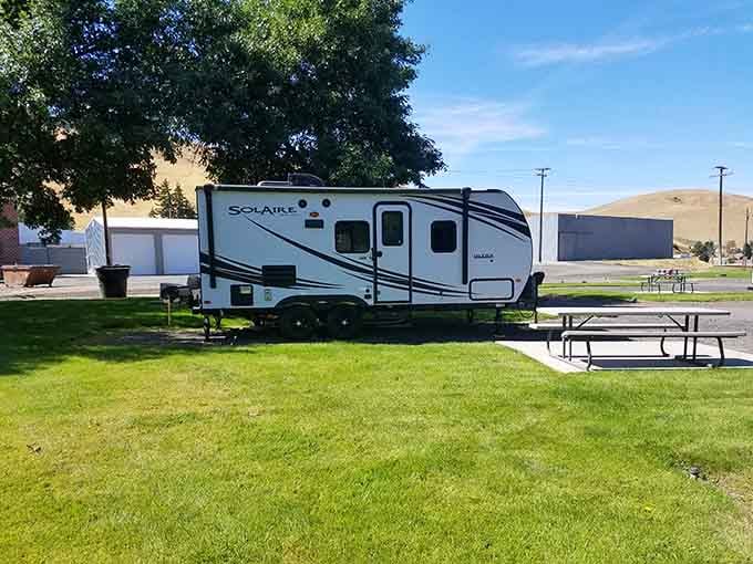 RV parks welcome travelers with green grass and mountain views instead of asphalt wastelands and highway noise.