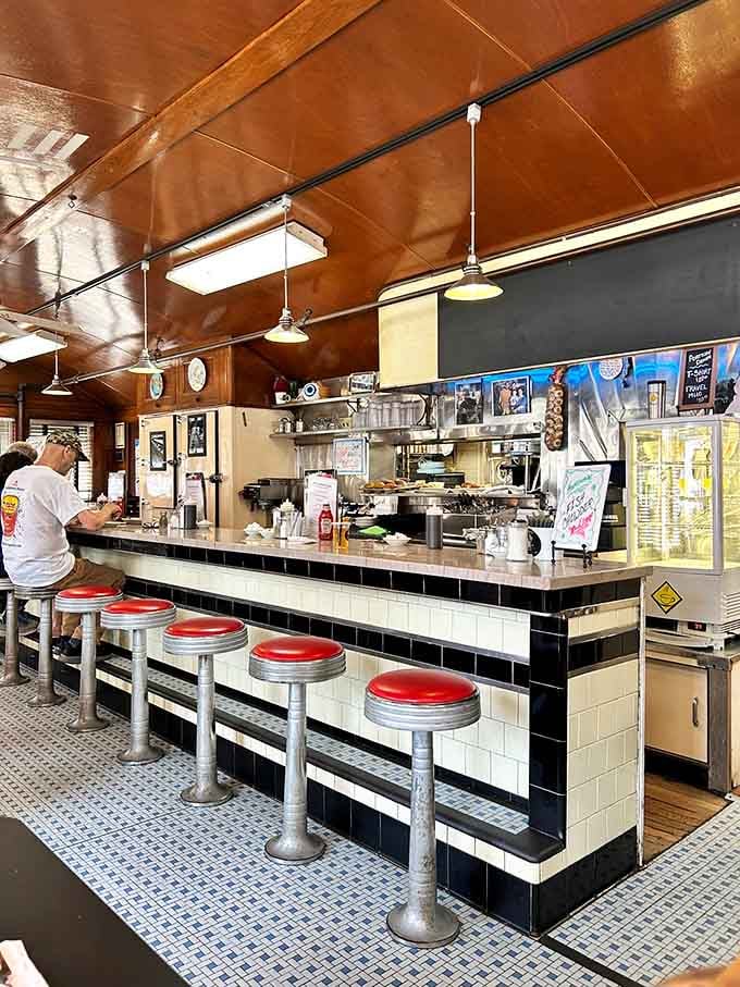 The counter gleams with promise, each stool a front-row seat to breakfast theater and griddle magic.