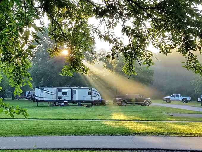 Morning light streaming through trees onto a campground looks like nature's own special effects department at work.