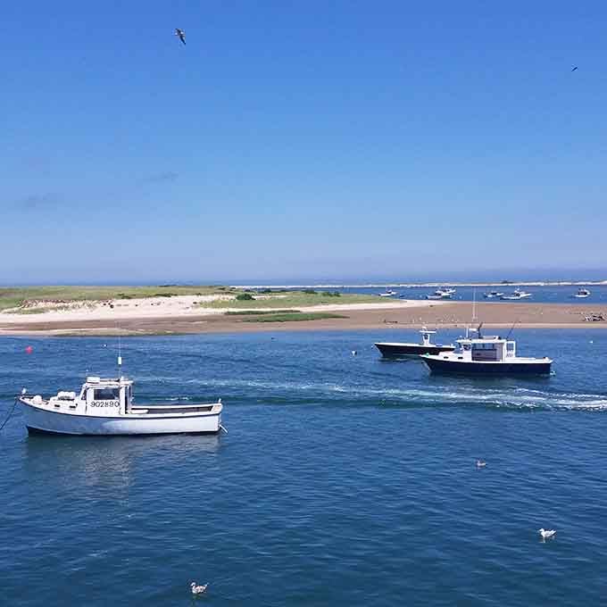 Working fishing boats bobbing in the harbor, reminding you this town has real roots beneath the charm.