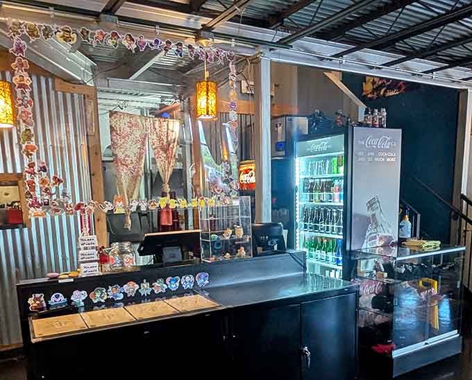 The ordering counter welcomes you with decorative touches and a cooler full of refreshing beverage options nearby.