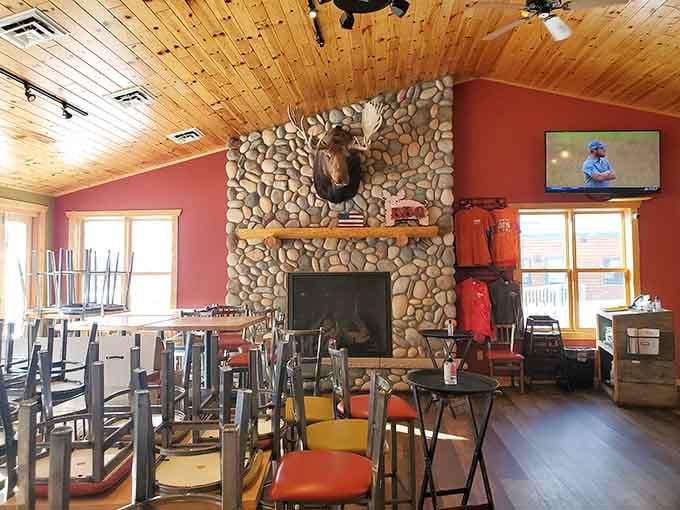 A moose head watches over diners like a benevolent forest guardian who really appreciates good brisket and company.