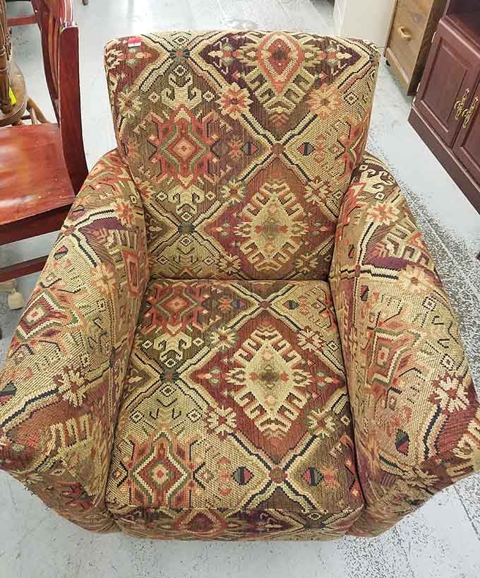 That patterned armchair is one reupholstering project away from being your favorite reading spot ever.