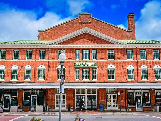 The City Market Building's grand brick facade houses one of America's oldest continuously operating farmers markets.
