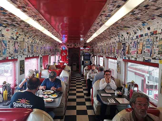 Happy diners enjoying breakfast in authentic train car booths proves this place delivers on its unique promise.
