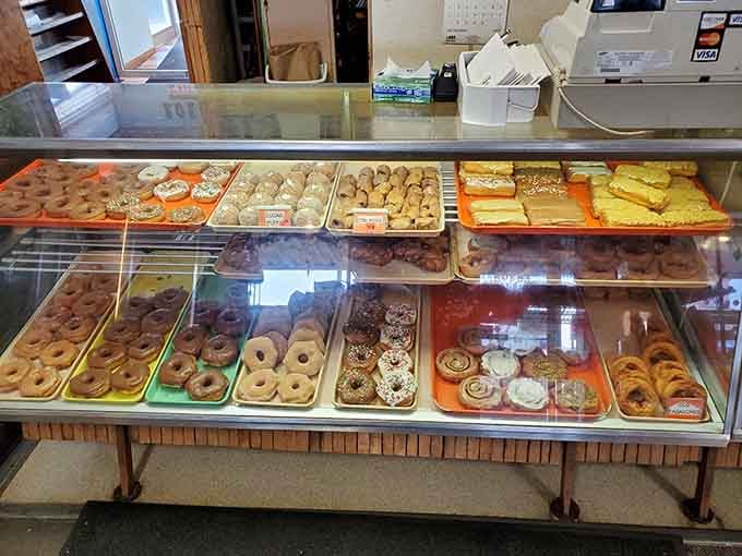 Display cases packed with donuts, bars, and pastries that make decision-making both exciting and slightly stressful simultaneously.